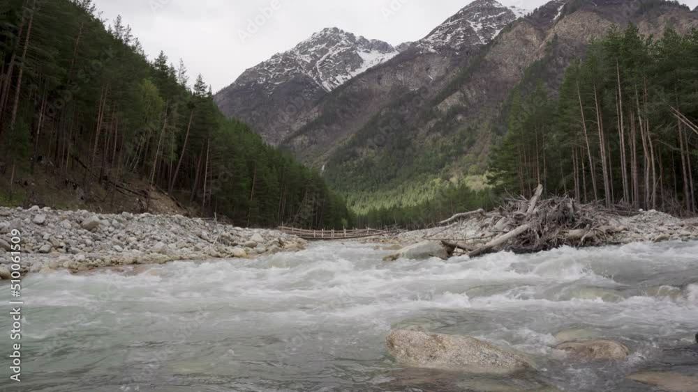 Wild mountain river running through stone rapids in Elbrus. Rapid clean ...