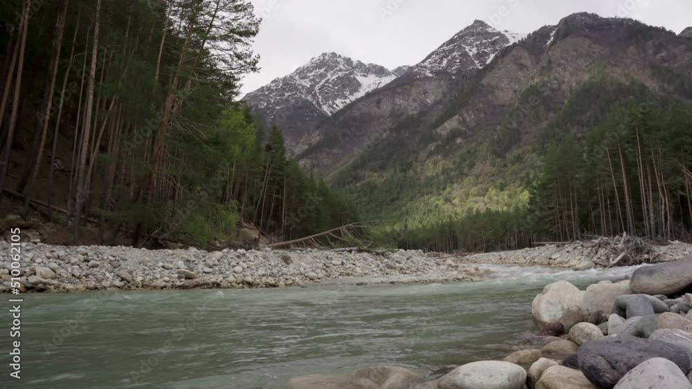 Wild mountain river running through stone rapids in Elbrus. Rapid clean ...
