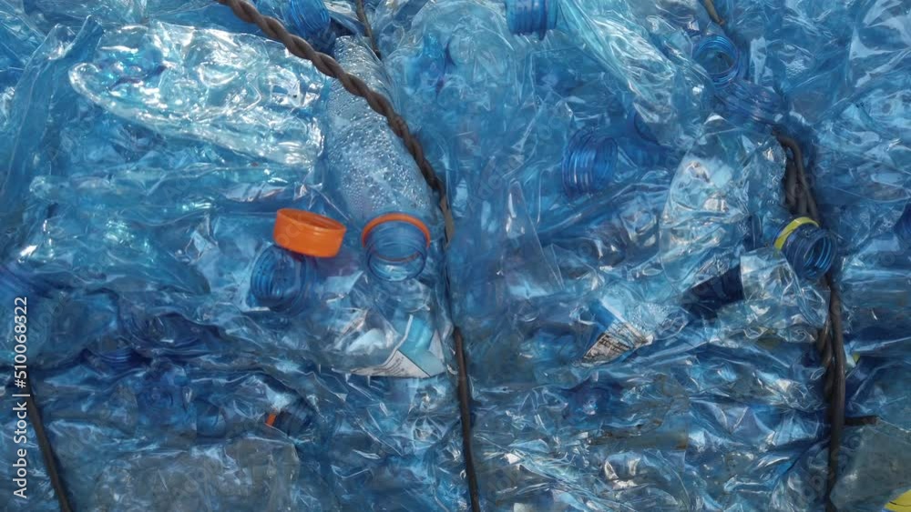 Plastic bottles collected in the sea and stacked for recycling ...