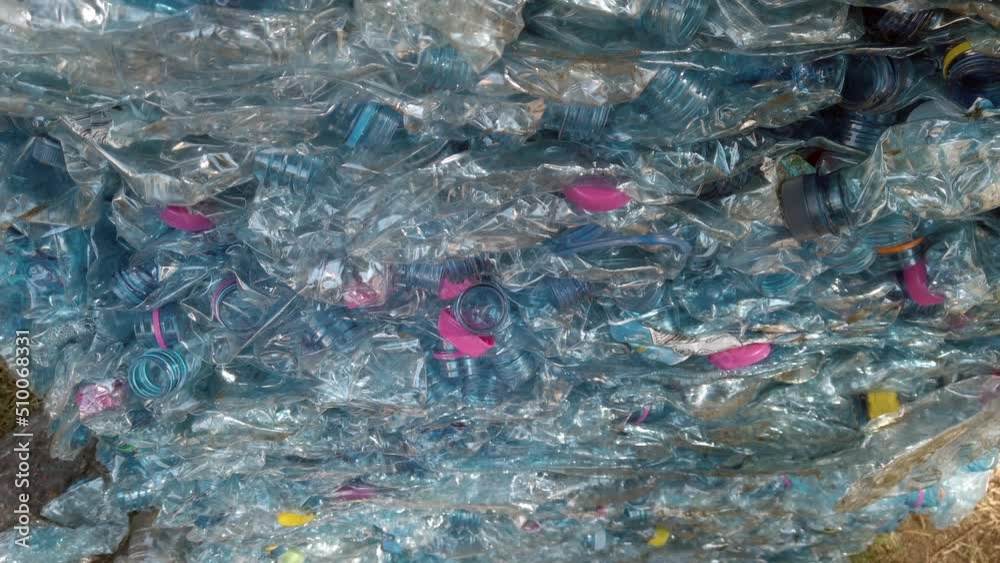 Plastic bottles collected in the sea and stacked for recycling ...