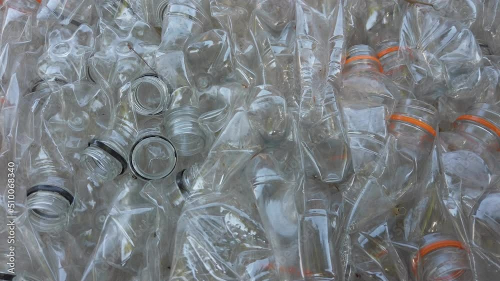 Plastic bottles collected in the sea and stacked for recycling ...