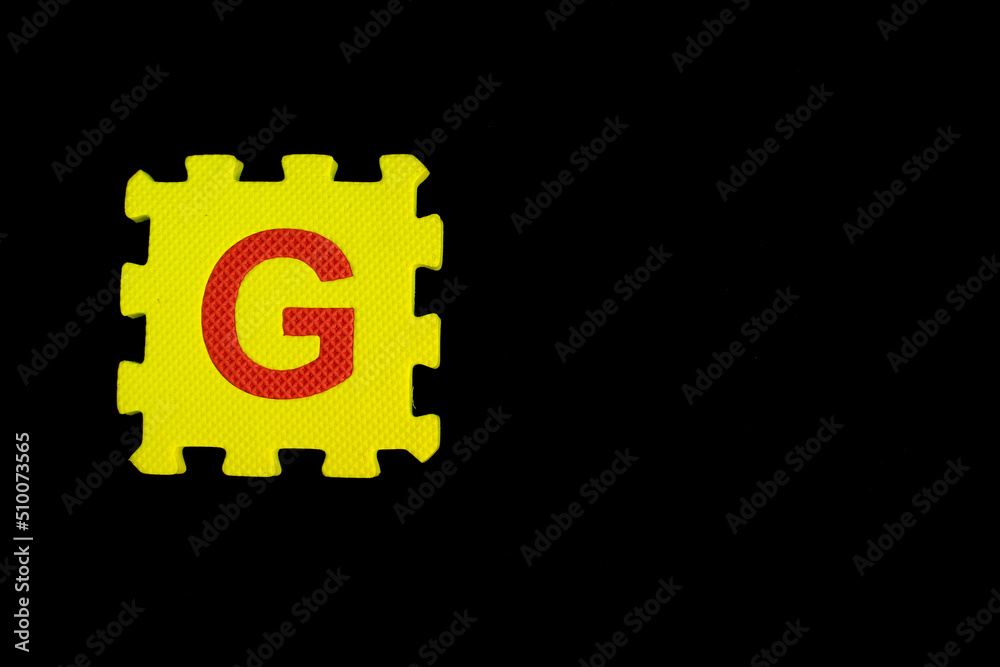 Colorful alphabet puzzle isolated on black background. alphabet ...