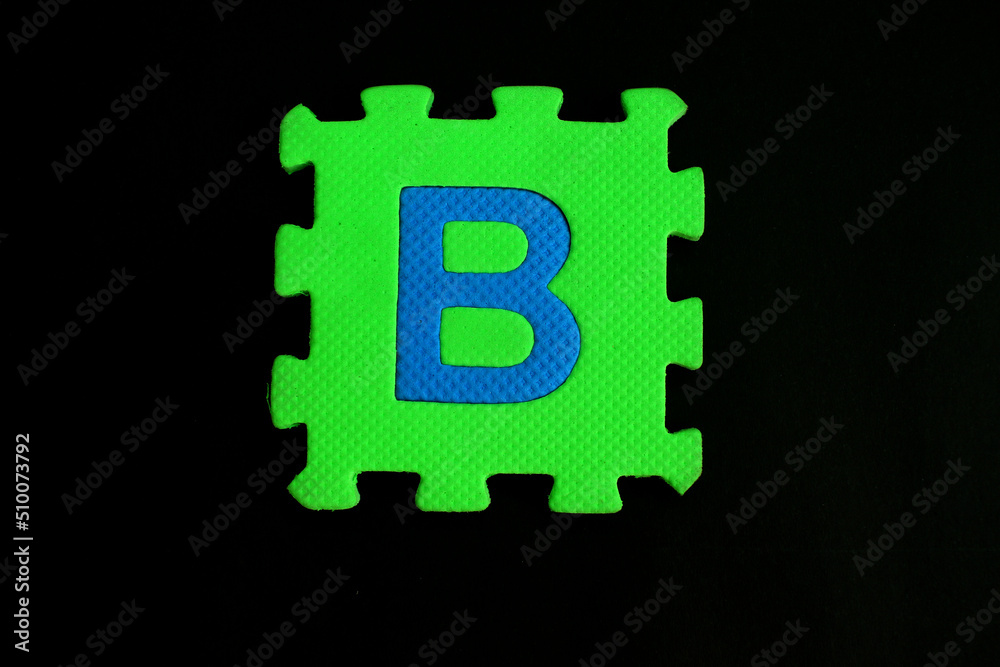 Colorful alphabet puzzle isolated on black background. alphabet ...