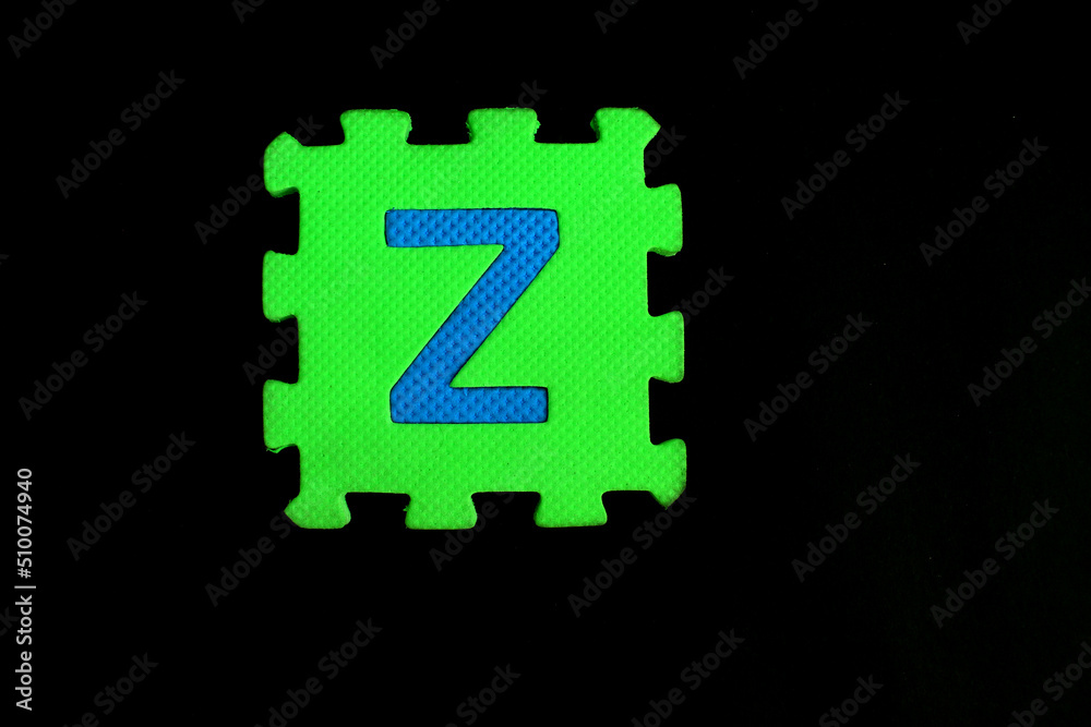 Colorful alphabet puzzle isolated on black background. alphabet ...