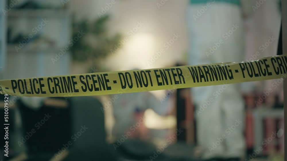 Crime scene tape close-up, forensic experts examining room, collecting ...