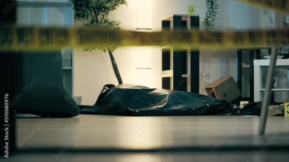 Messy crime scene with dead victim in body bag on floor and evidence ...