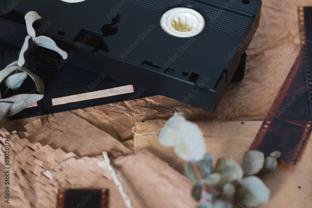 Vintage old-fashioned ways to keep memories. VHS, disk and cd's on a ... Vintage old-fashioned ways to keep memories. VHS, disk and cd's on a ...