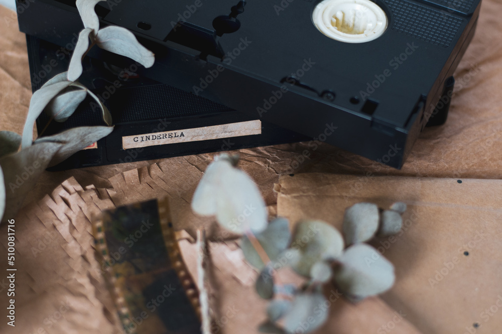 Vintage old-fashioned ways to keep memories. VHS, disk and cd's on a ... Vintage old-fashioned ways to keep memories. VHS, disk and cd's on a ...