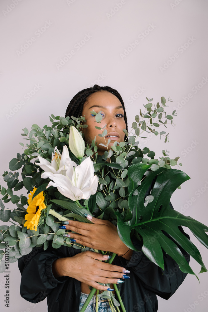 beautiful dark-skinned girl with black pigtails on a white background ...