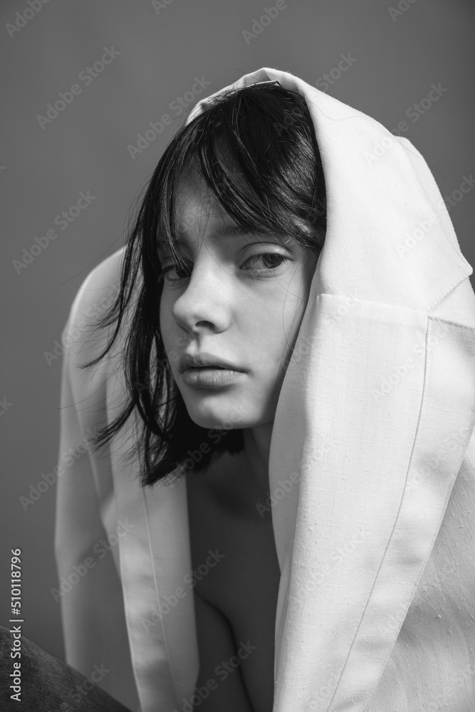 black and white portrait of a girl with short black hair with a white ...