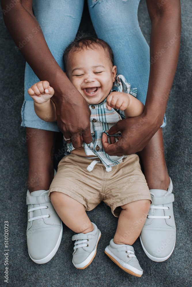 An Adorable Baby Laughs as His Mother Tickles his Belly Stock Photo ...