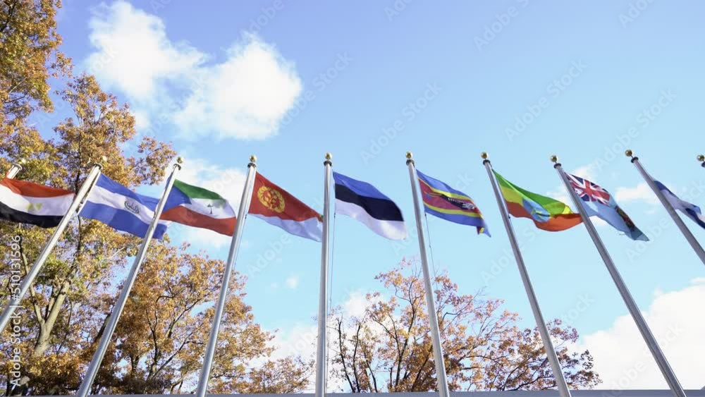 Flags flying in wind in front of United Nations in NYC. Estonia ...
