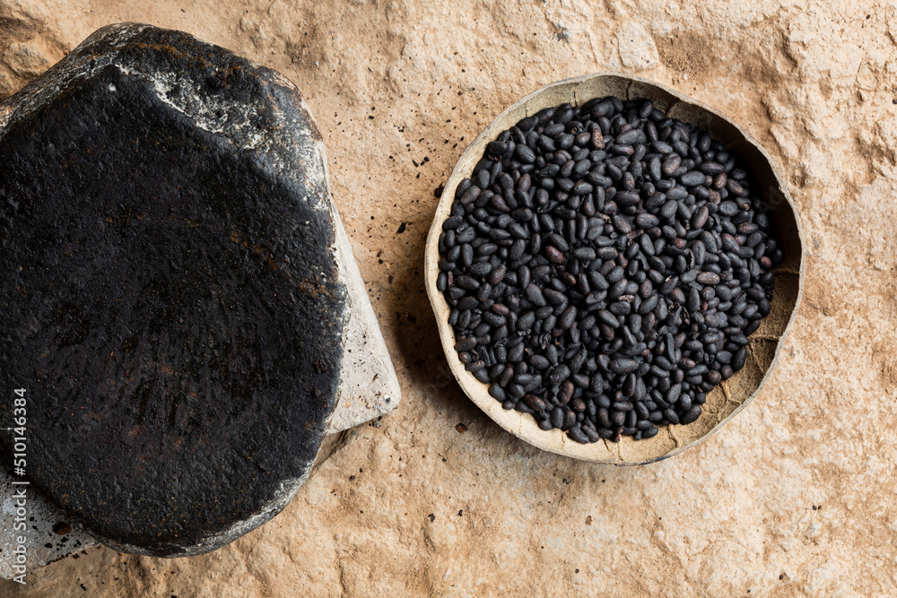 Burnt cocoa beans inside a calabash gourd on the ground Stock Photo ...