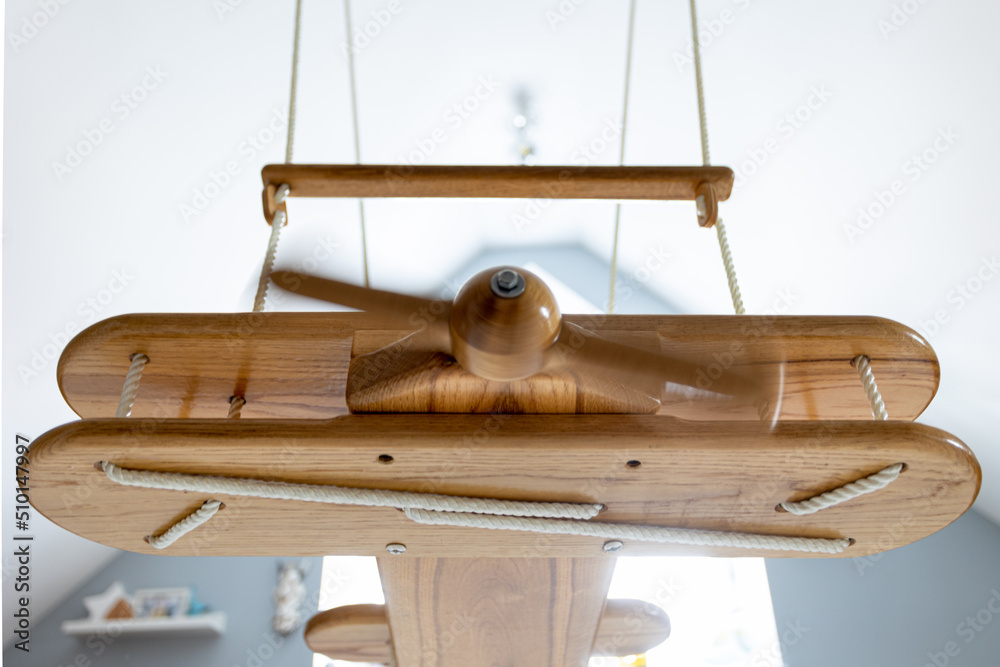 Wooden plane on ropes as part of a modern home interior design Stock ...