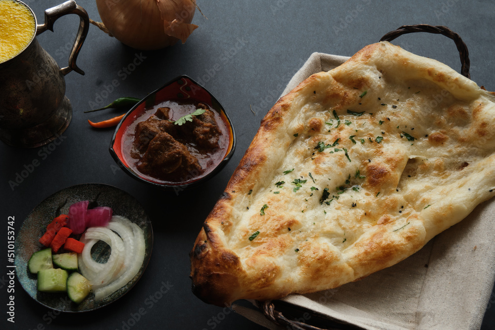 Goat / Mutton Curry and Garlic Naan with Mango Lassi Stock Photo ...