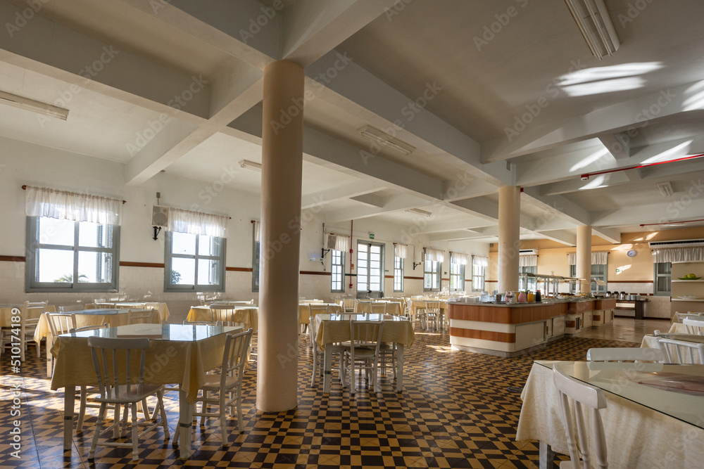 Spacious sunny dining room in retro design With a buffet full of food ...