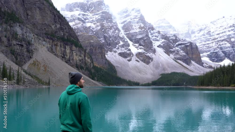 Young man near Moraine lake Valley of the Ten Peaks. Tourist in Banff ...