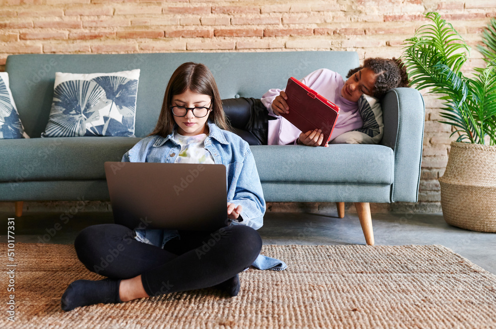 Teens using devices at home after school Stock Photo | Adobe Stock