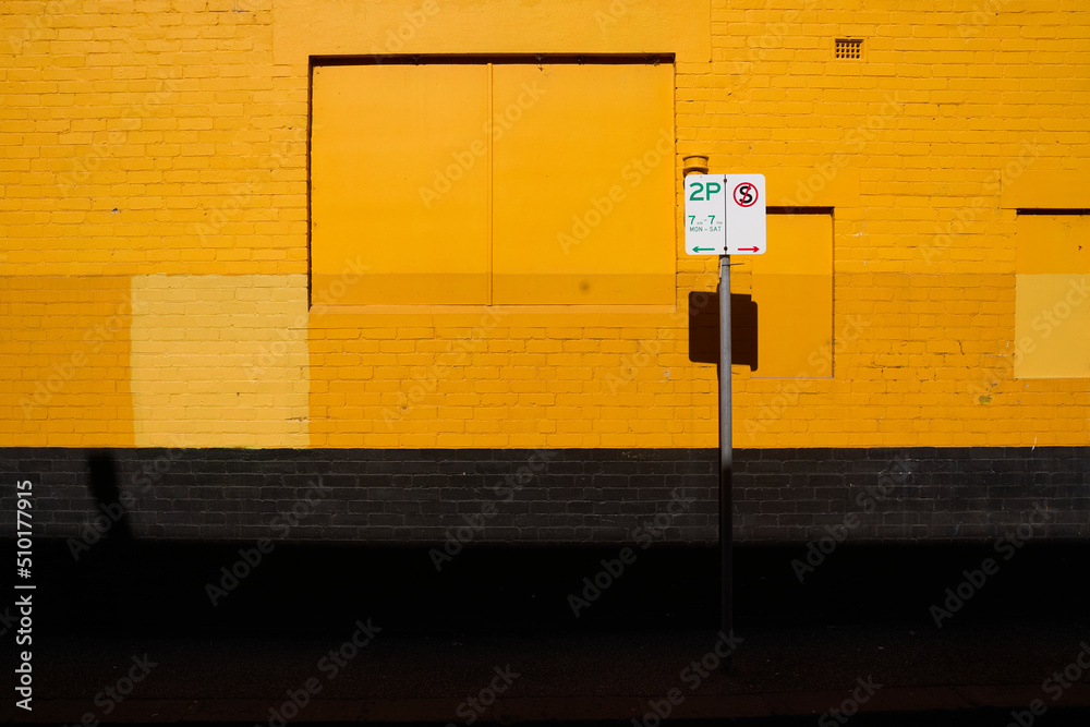 Bright yellow and black brick wall as background Stock Photo | Adobe Stock