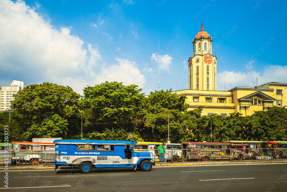 April 8, 2019: Clock tower of Manila City Hall with jeepney. The clock ...