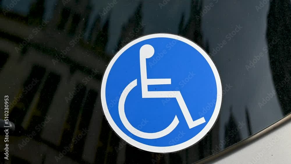 Disability car sticker. Sticker on a car. Sign of a person with a ...