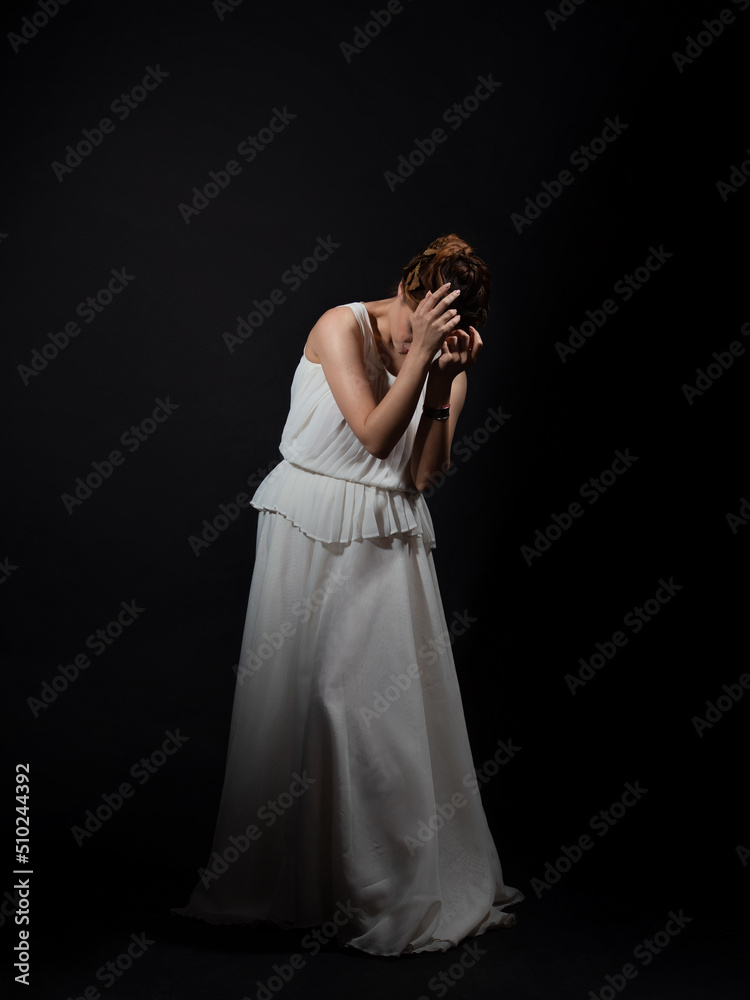 The heroine of an ancient tragedy in grief and loss. A young woman in a ...