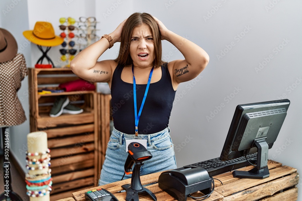 Young brunette woman holding banner with open text at retail shop crazy ...