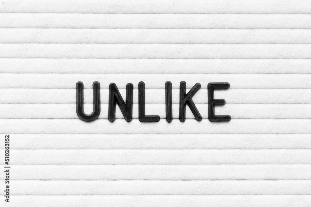 Black color letter in word unlike on white felt board background Stock ...