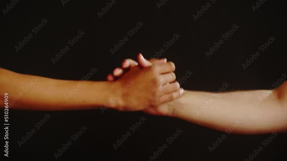 Diverse people making handshake gesture isolated on black background ...