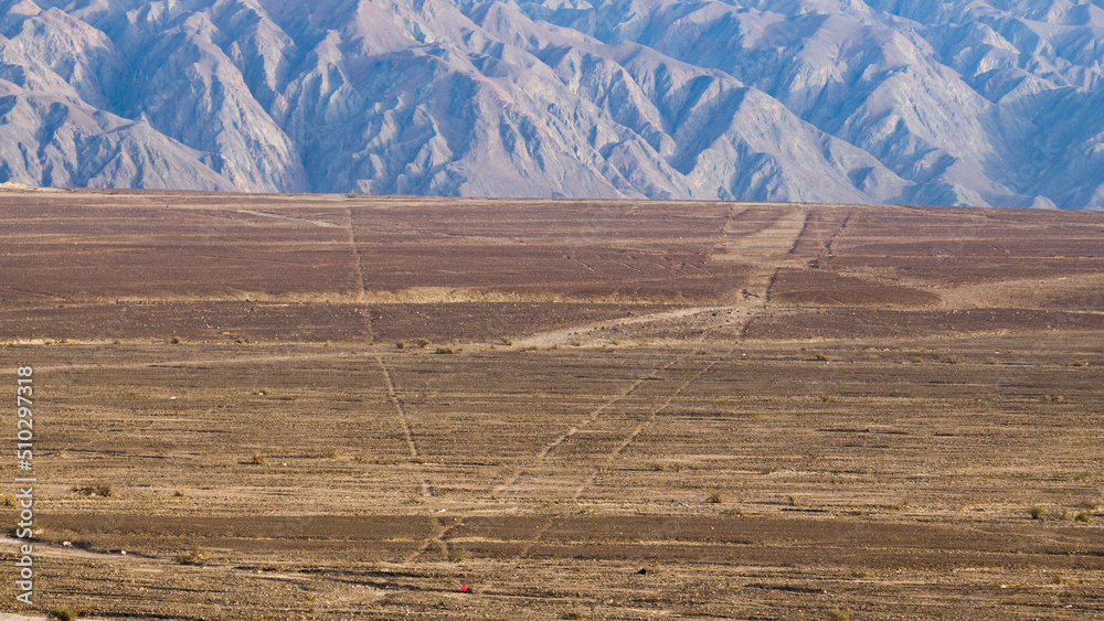 crossed Nazca Lines and andes mountains in background landscapes ...