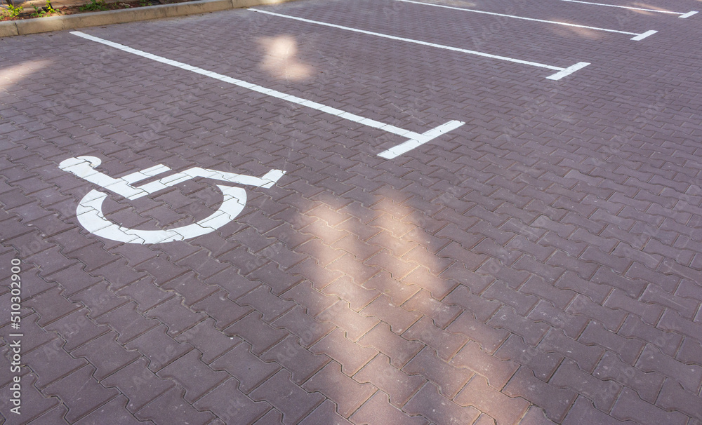 Parking lot for disabled. Parking sign wheelchair on the road. Parking ...