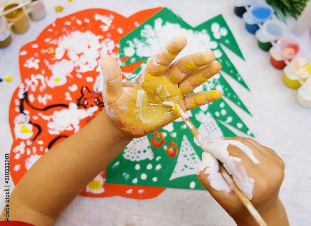 Child making a greeting card Craft for children. Child painting by ...