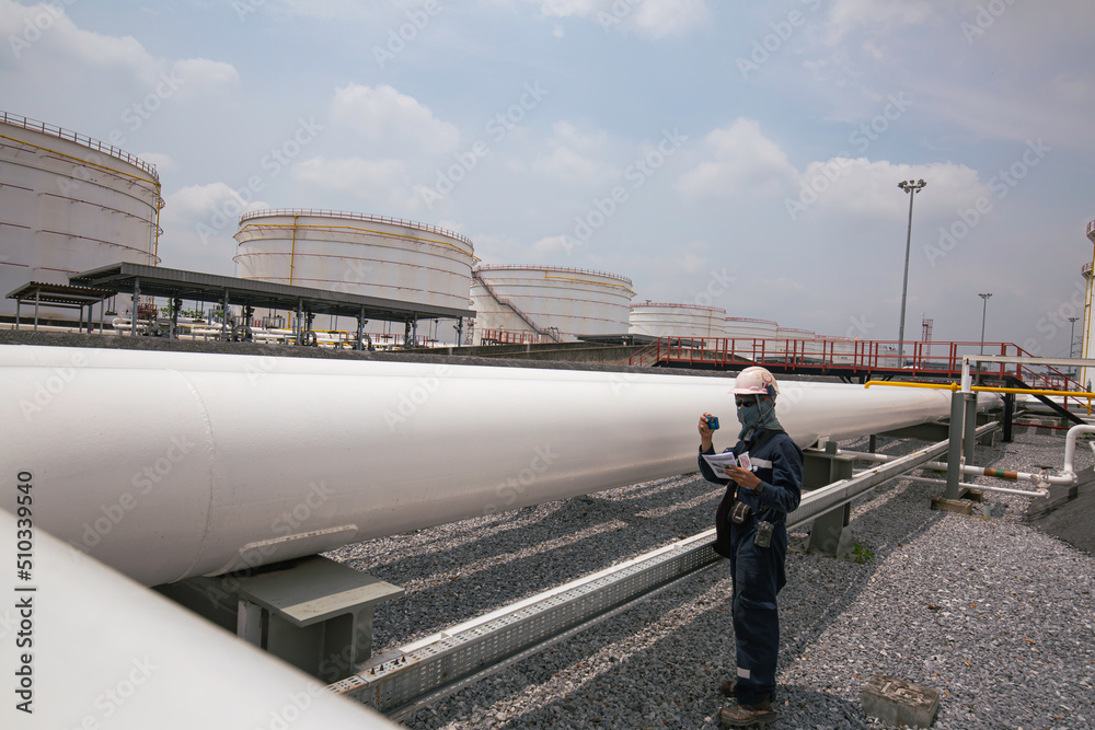 Male worker inspection at flange pipe of visual check record pipeline ...
