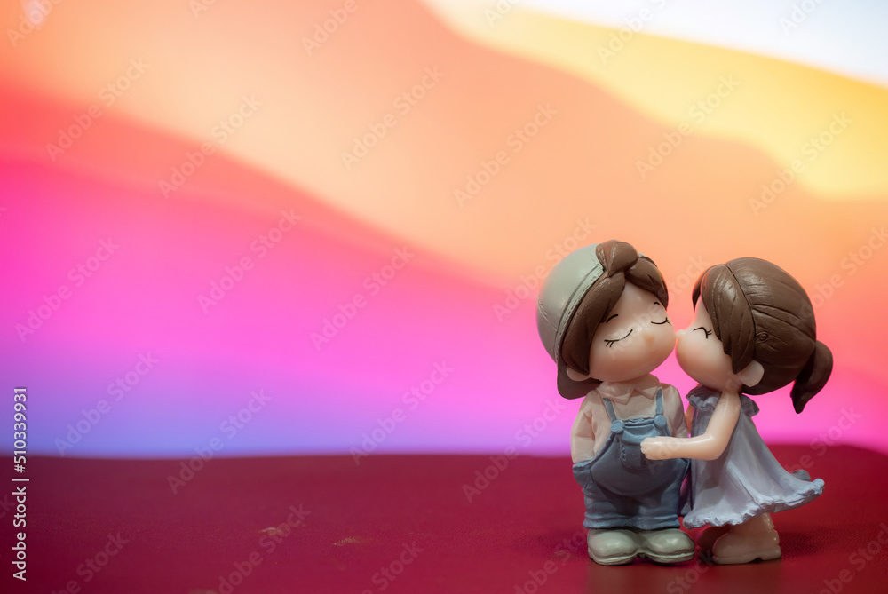 Miniature doll couple boy and girl kissing each other with love with ...