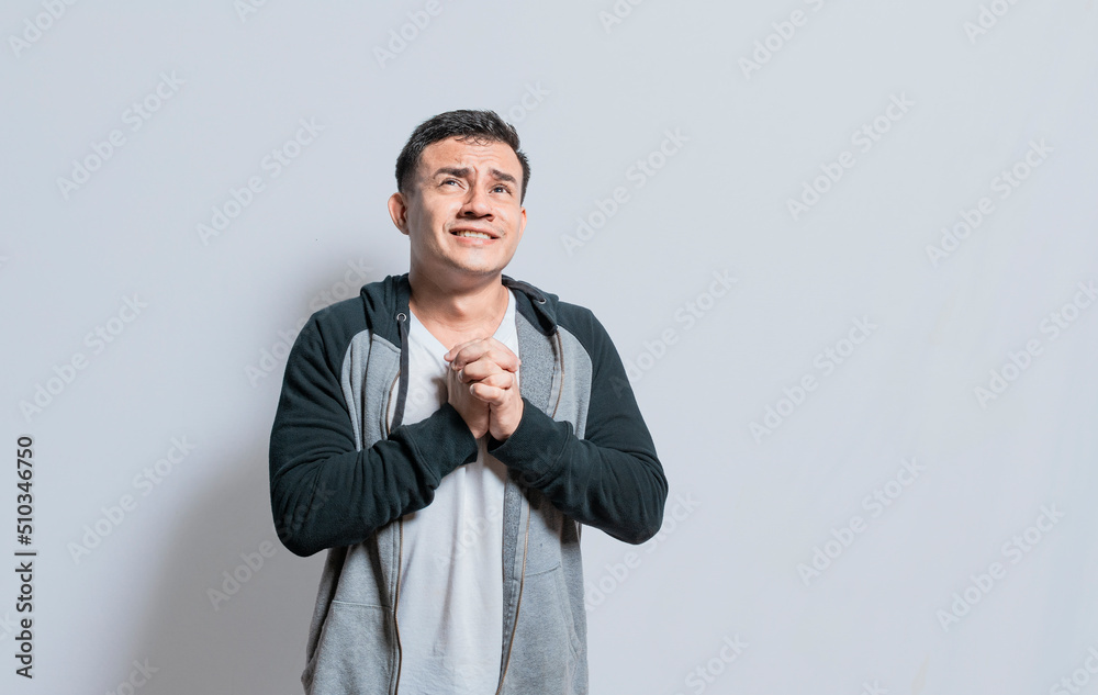 Distressed man asking for a favor, People putting hands together asking ...