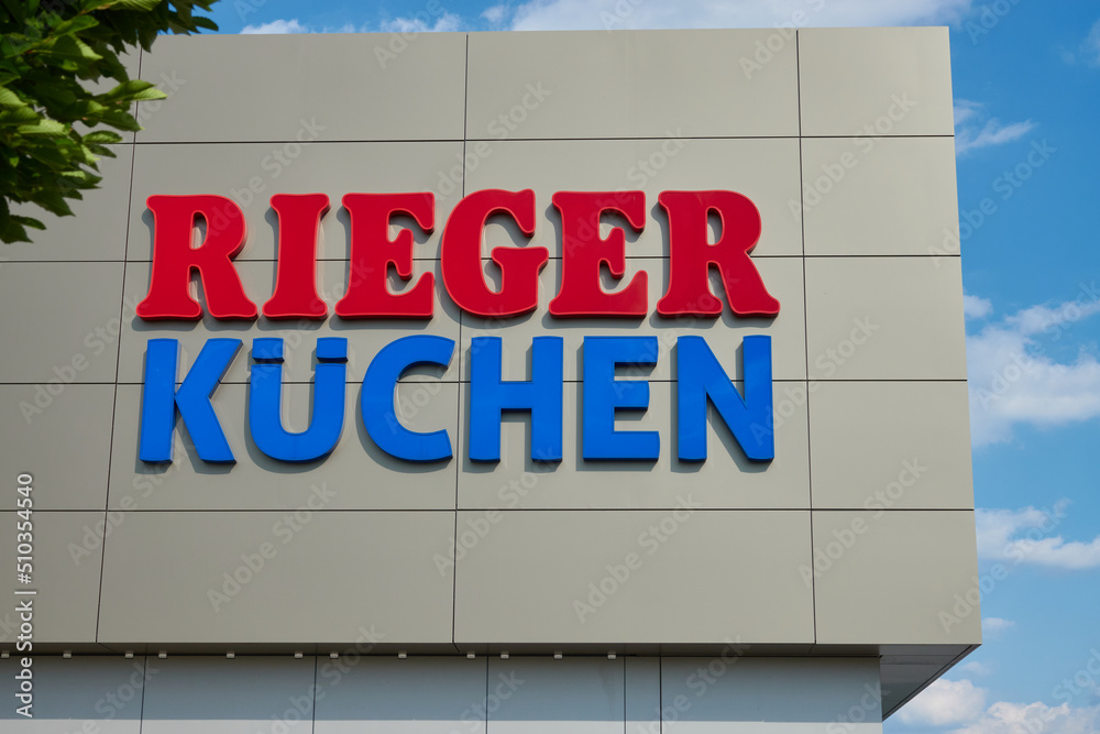 Kitchens Rieger (Küchen Rieger) Fasade, blue and red letters, lots of ...