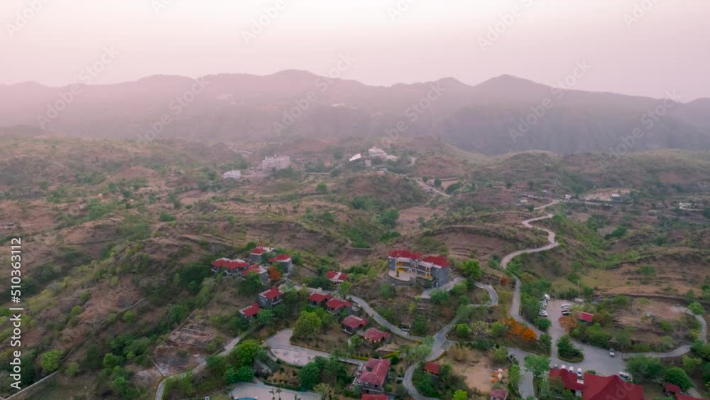 aerial drone shot showing huge resort getaway in the middle of ...