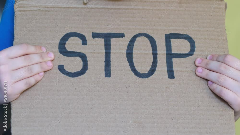 poster with the inscription stop hold the hands of the child.violation ...