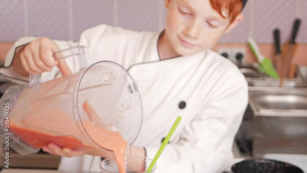 boy with red hair, chef prepares berry smoothie in blender, summer ...