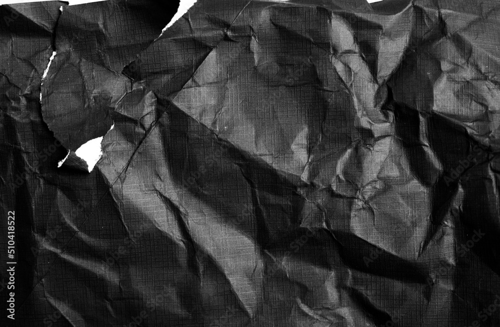 Black paper with white tears for the background. Crumpled paper texture ...