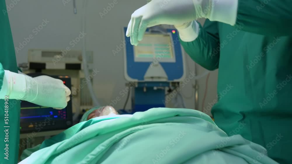 A team of doctors in the operating room mourns the patient who died ...