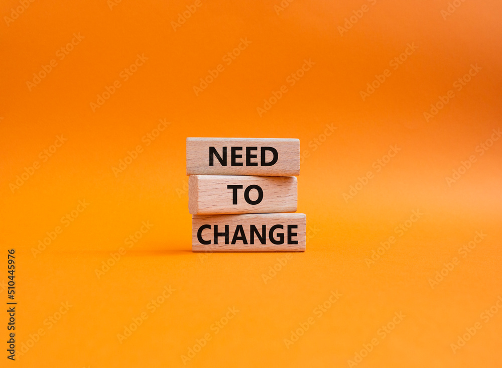 Need to change symbol. Concept words 'Need to change' on wooden blocks ...