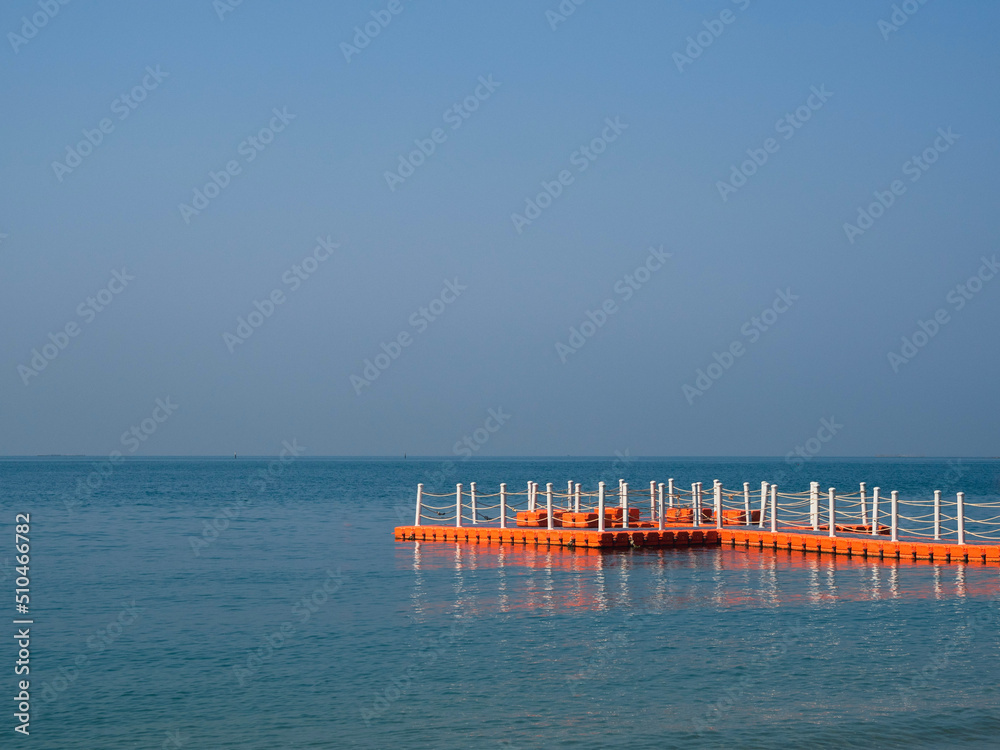 Floating piers along shore are place for tourists walk. Mooring boat ...