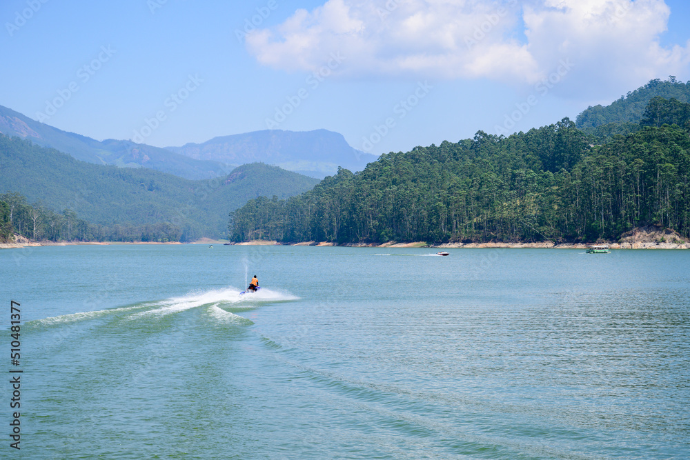 Foto de Boating in Mattupetty Dam in Munnar, India do Stock | Adobe Stock
