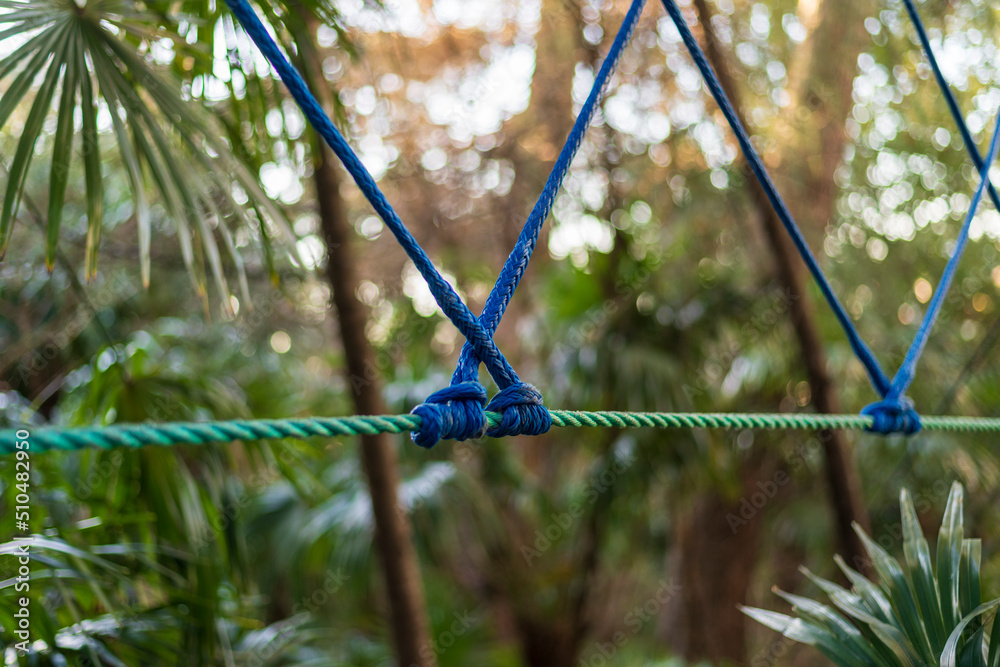 Rope amusement park. Knots for aerial rope crossing in the jungle Stock ...