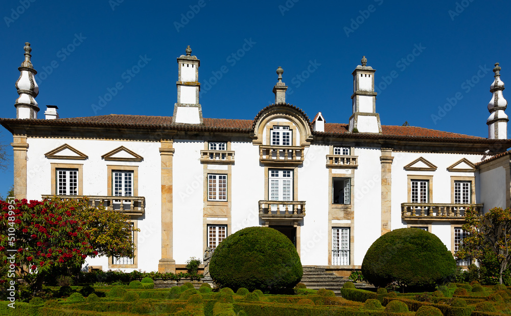 Scenic view of green landscaped backyard and manor building of Mateus ...