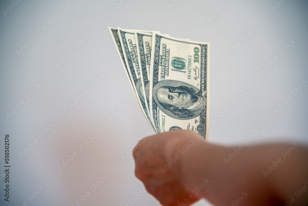 Hand holding loan money dollar bank note give financial payment. Man ...