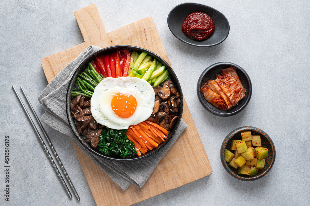 Bibimbap on a concrete background, traditional korean dish, top view ...