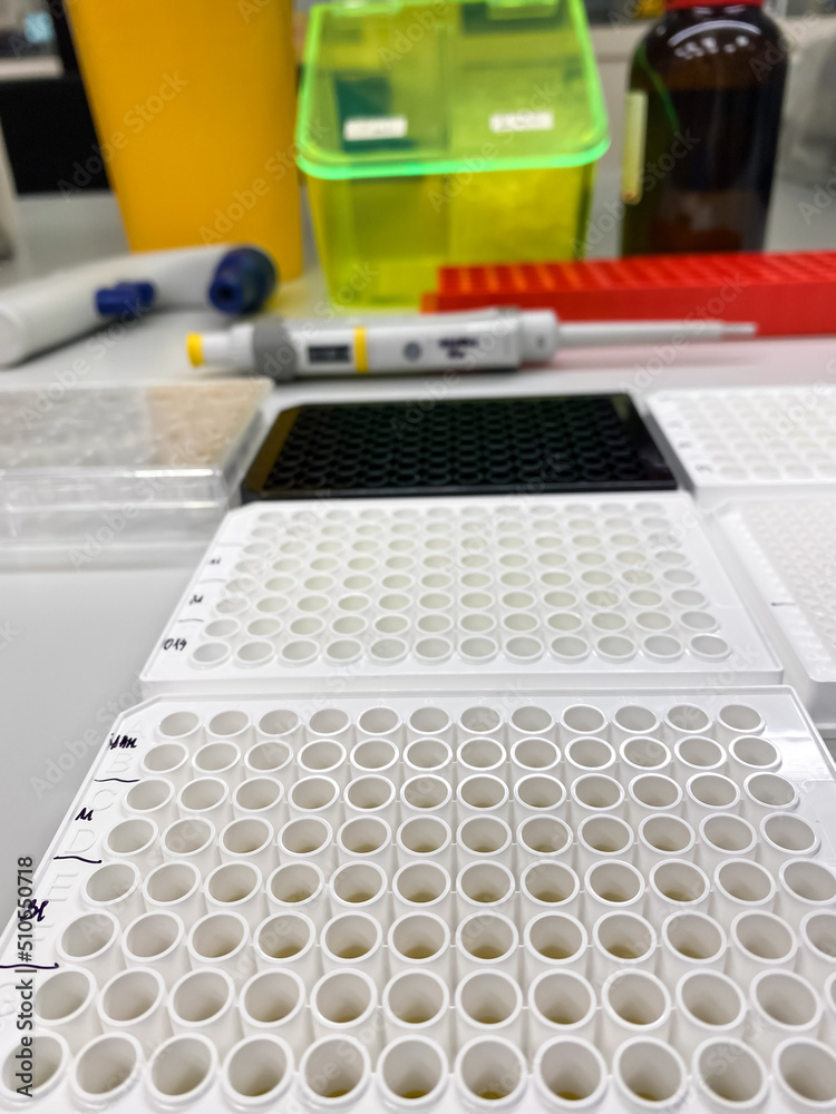 Different types of multiwell plates on the laboratory bench. Such ...
