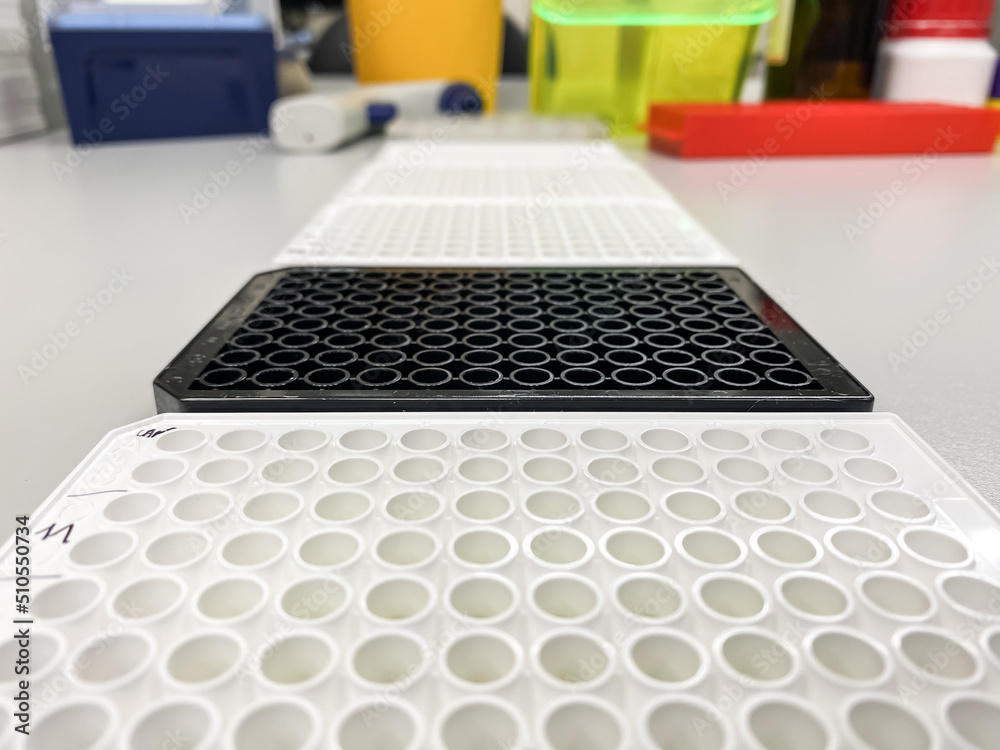 Different types of multiwell plates on the laboratory bench. Such ...
